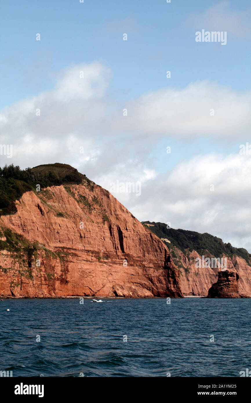 Towering red sandstone cliffs on the East Devon coast. UK. Rock, strata ...