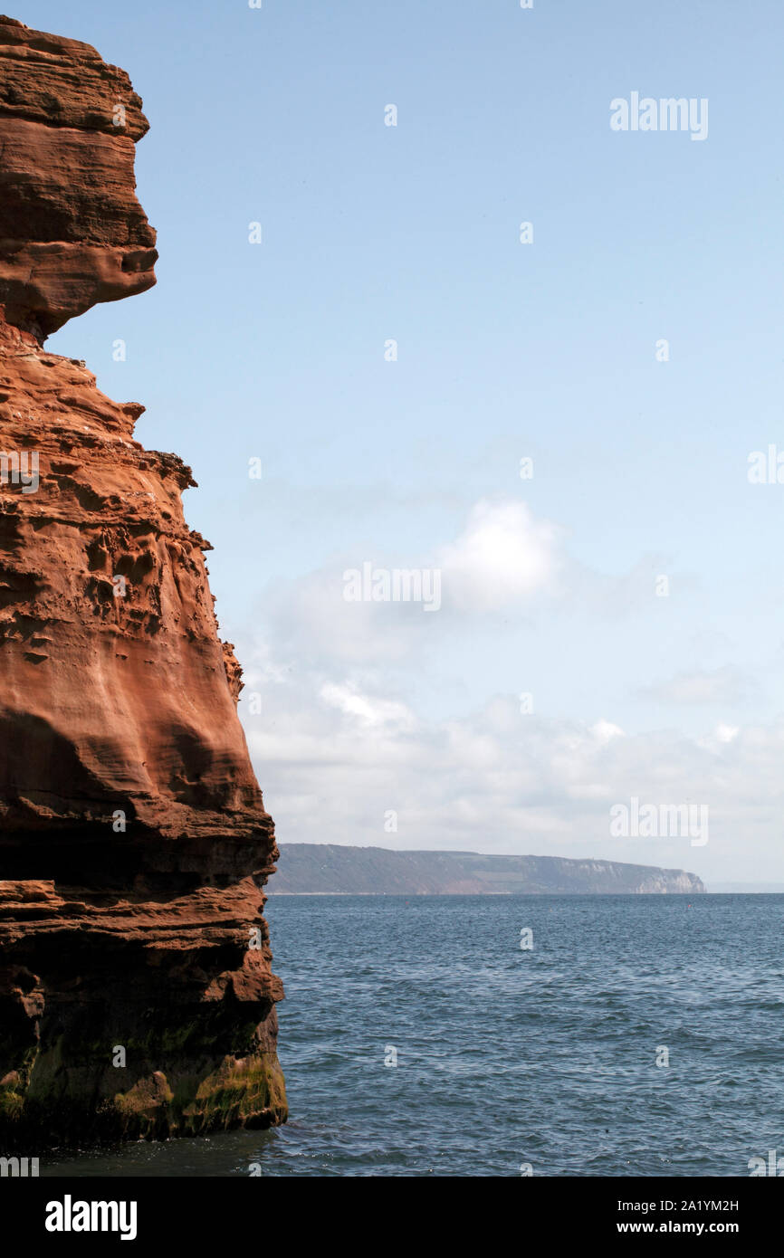 Towering red sandstone cliffs on the East Devon coast. UK. Rock, strata ...