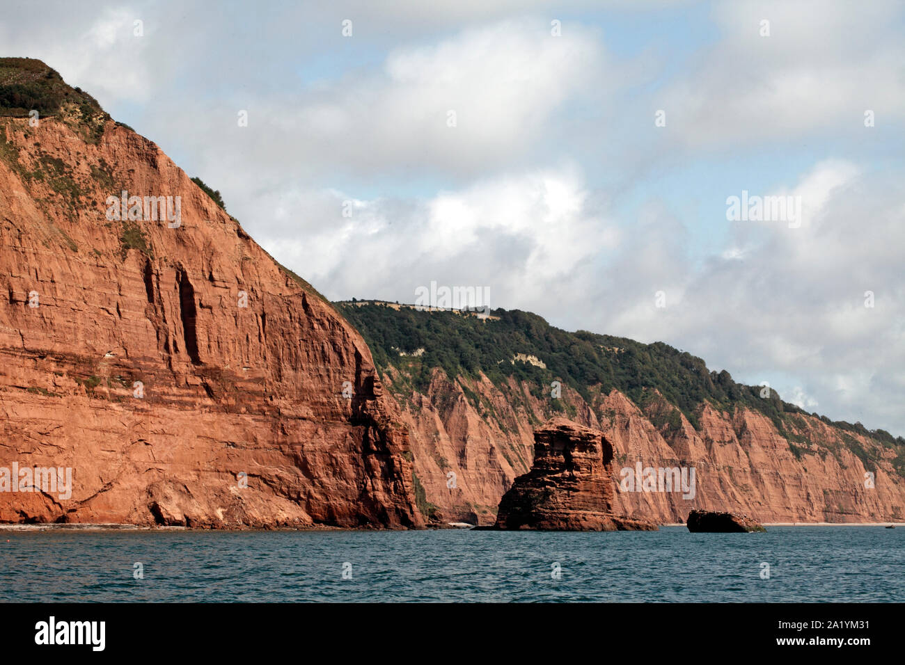 Towering red sandstone cliffs on the East Devon coast. UK. Rock, strata ...