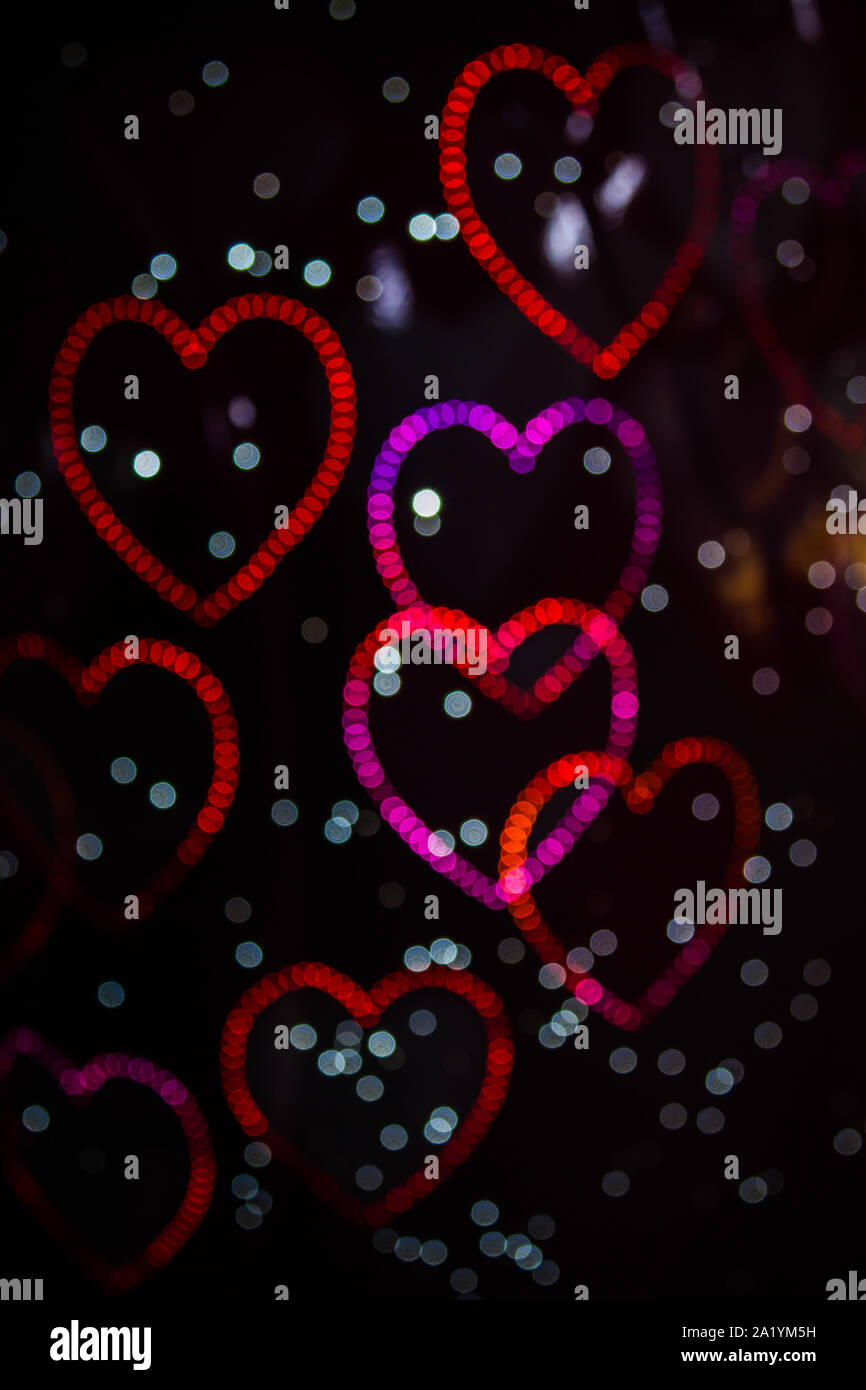 A background image of many hearts created by LED lights and the Bokeh ...
