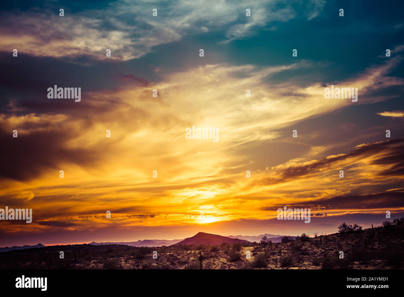 A sunset over the Sonoran Desert of Arizona with high altitude clouds ...