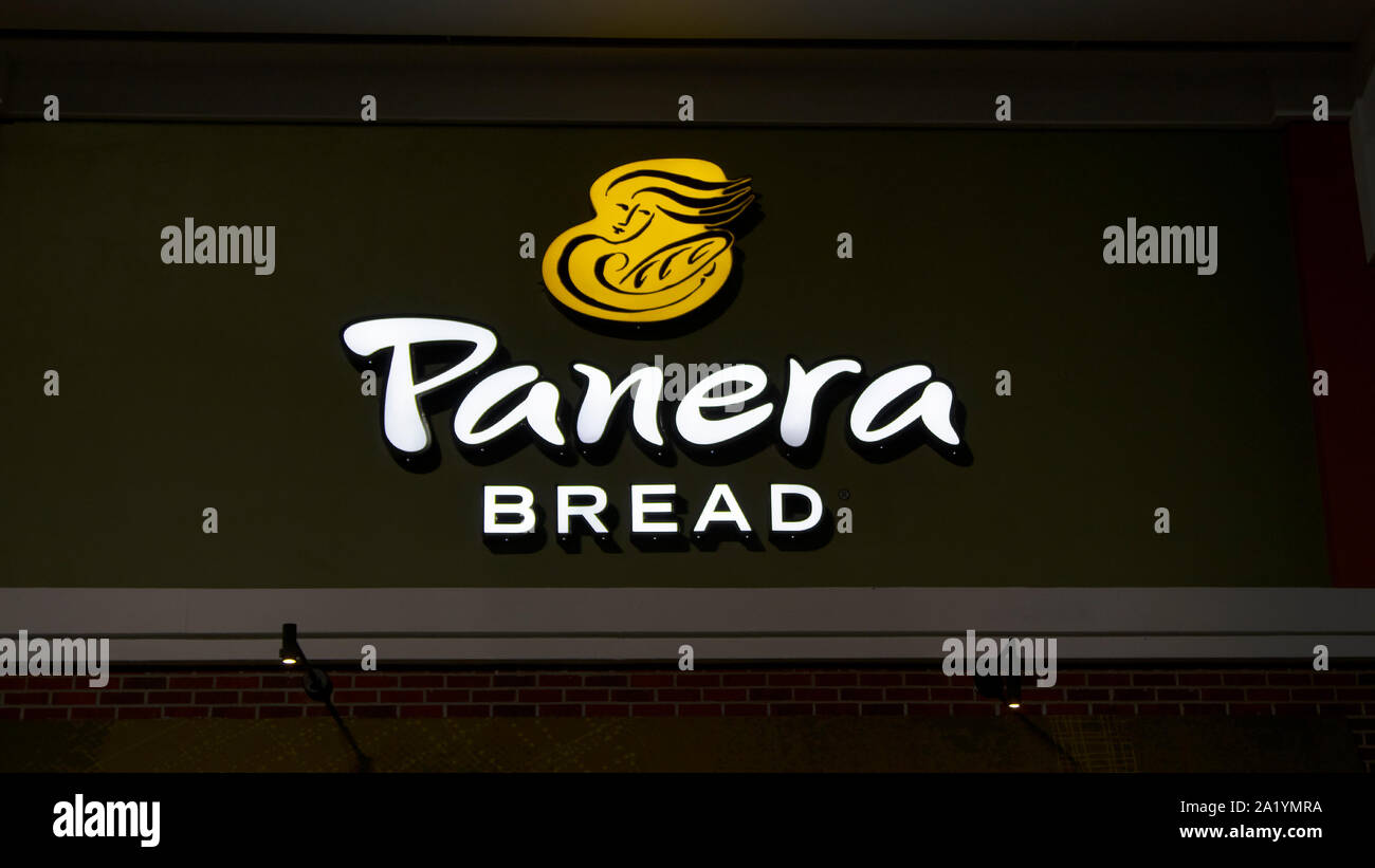 Panera restaurant sign glowing in the dark at dawn Stock Photo - Alamy