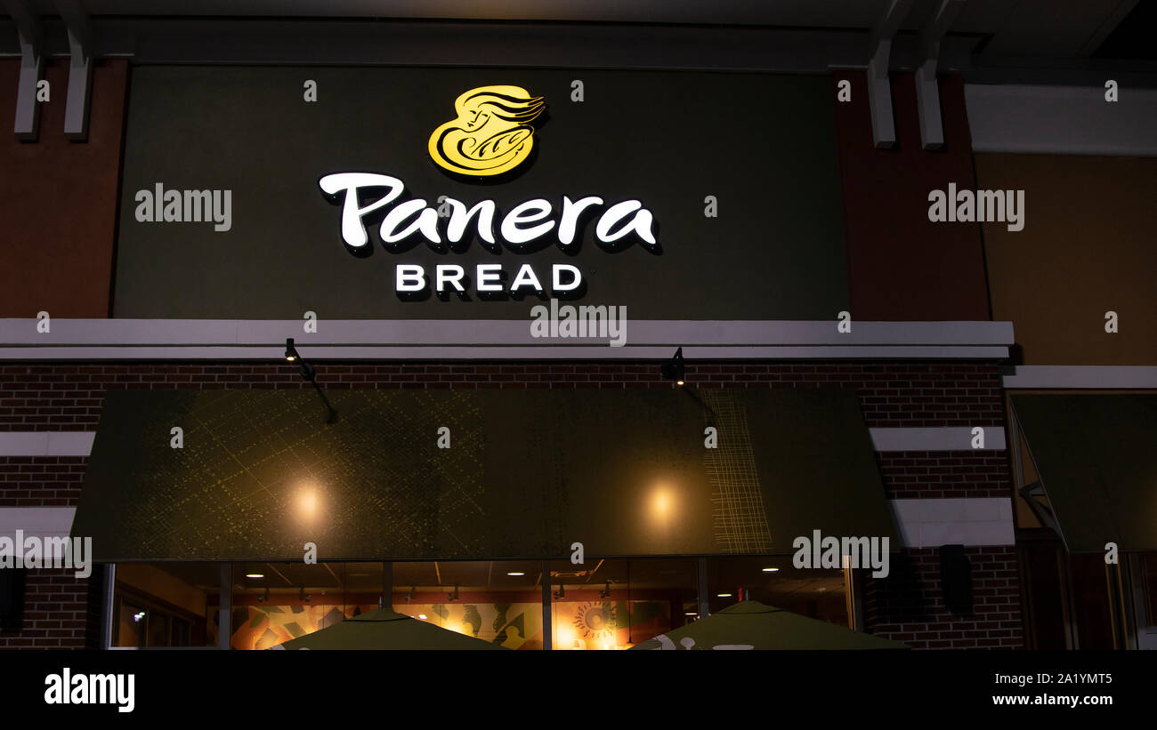 Panera restaurant sign glowing in the dark at dawn Stock Photo - Alamy