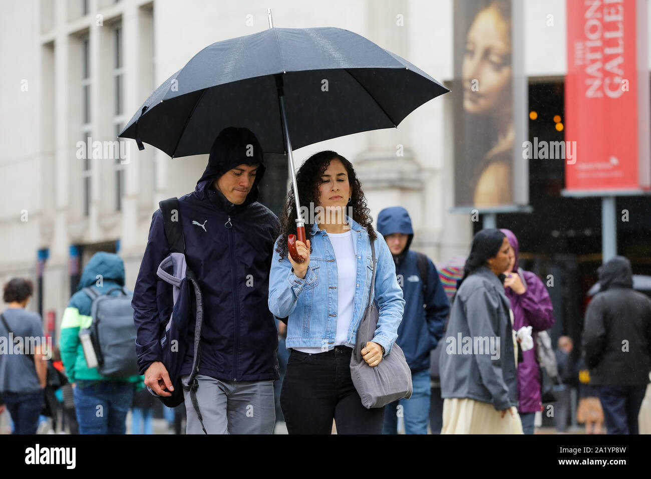 Couple Sheltering From The Rain High Resolution Stock Photography and ...
