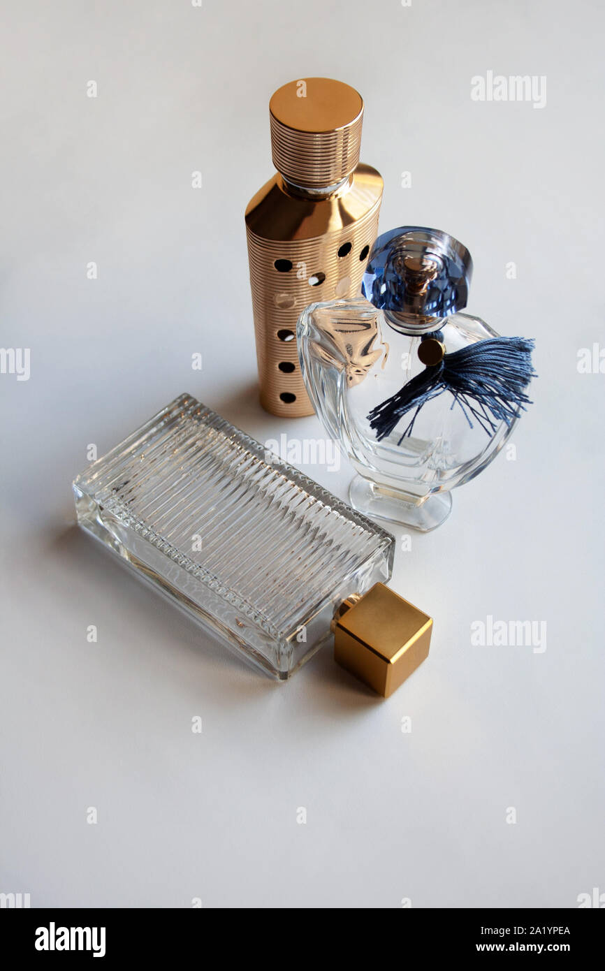 Three perfume bottles isolated on white background Stock Photo - Alamy