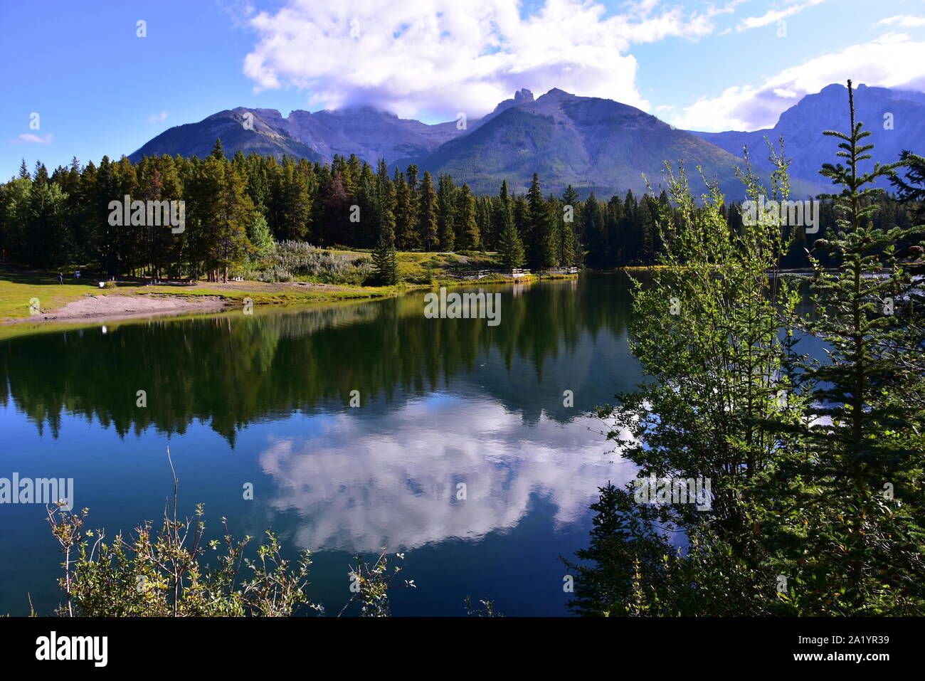 Reflections in Johnson lake, Banff national park, Alberta, Canada Stock ...
