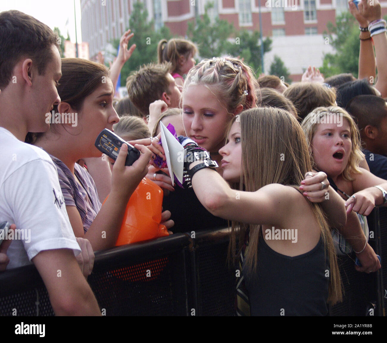 AUGUST 2: Avril Lavigne signs autographs and poses for pictures with ...