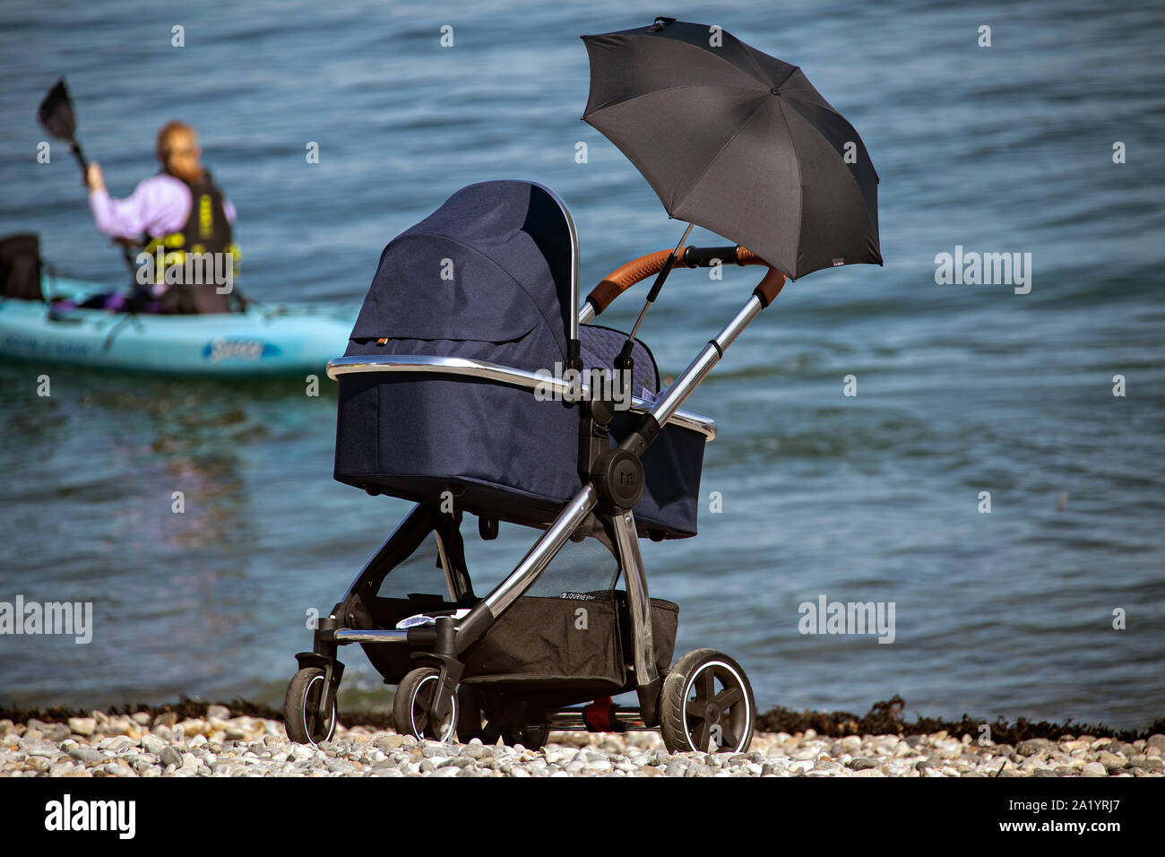 beach boats and prams Stock Photo - Alamy