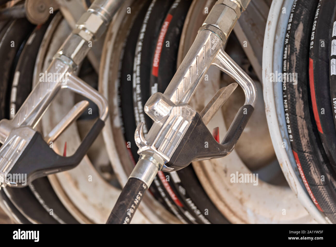 industrial fuel pump, few refueling nozzles with rubber pipes Stock ...