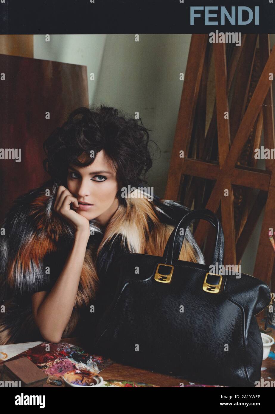 poster advertising FENDI fashion house with Anja Rubik in paper ...