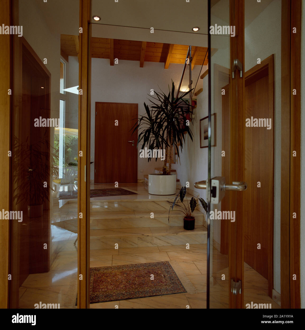 Entrance into hallway from glass door Stock Photo - Alamy