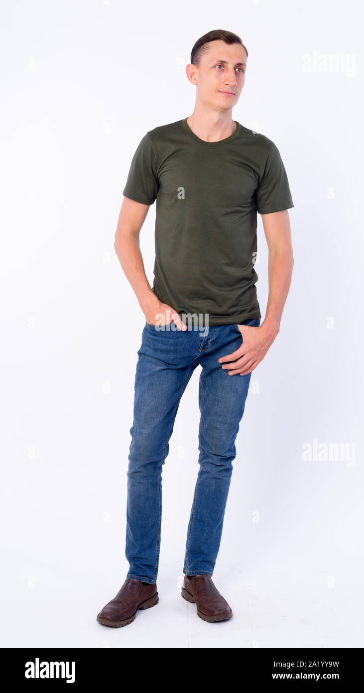 Full body shot of man thinking and looking away Stock Photo - Alamy