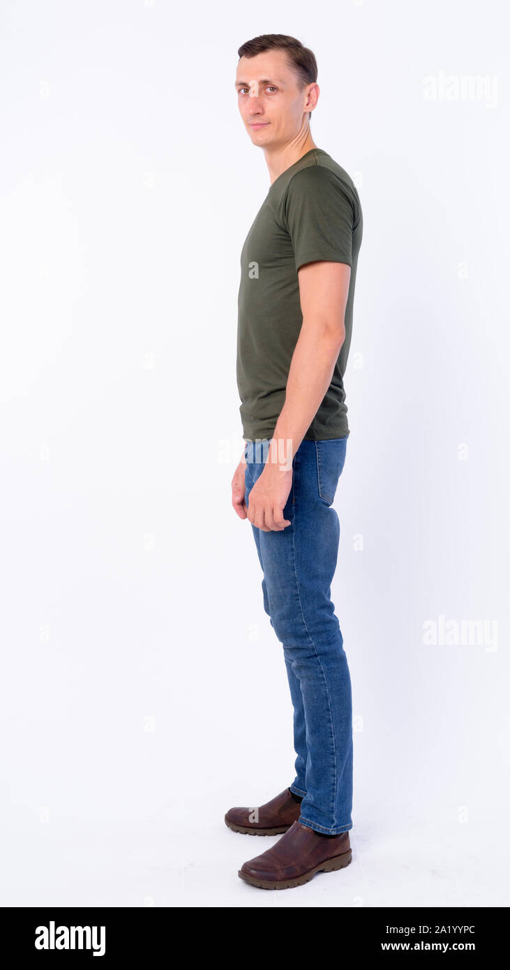 Full body shot profile view of man looking at camera Stock Photo - Alamy