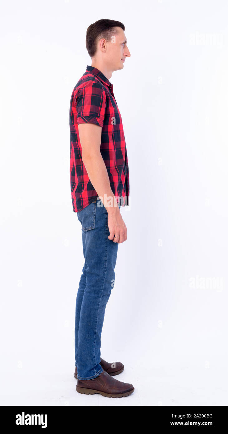 Full body shot profile view of hipster man Stock Photo - Alamy