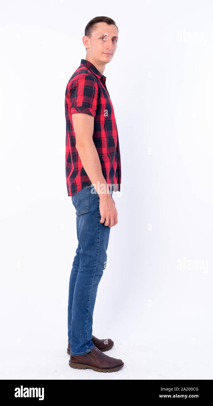 Full body shot profile view of hipster man looking at camera Stock ...