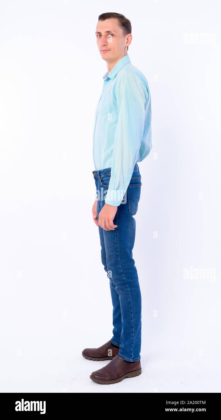 Full body shot profile view of businessman looking at camera Stock ...