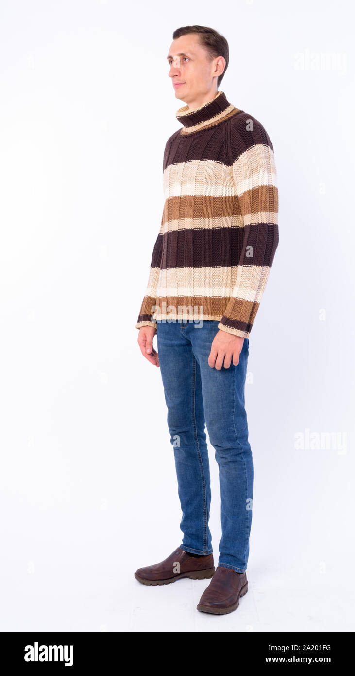 Full body shot of man thinking and looking away ready for winter Stock ...