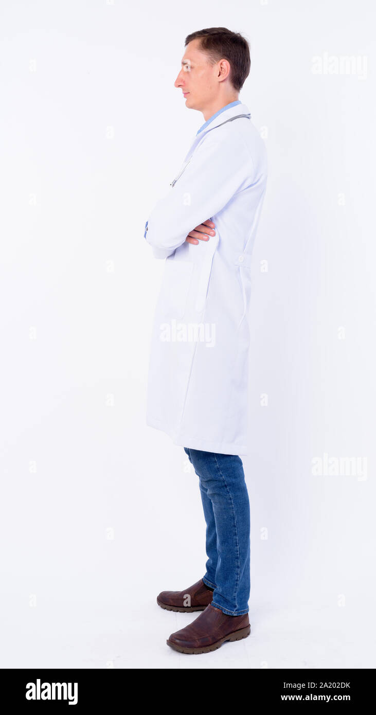 Full body shot profile view of man doctor with arms crossed Stock Photo ...