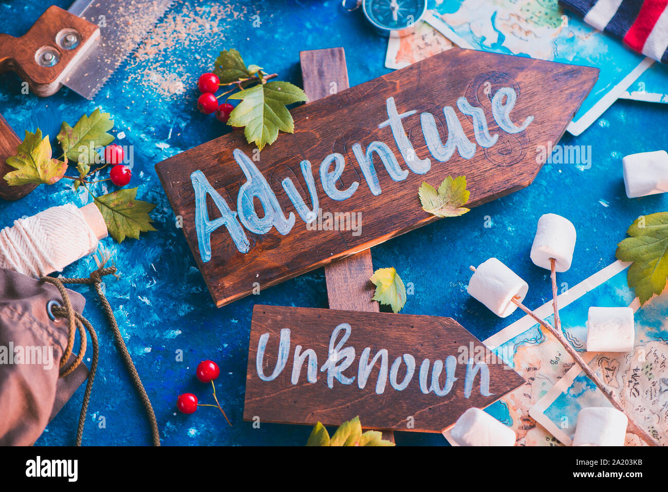 Road sign with Adventure and Unknown directions. Travel essentials ...