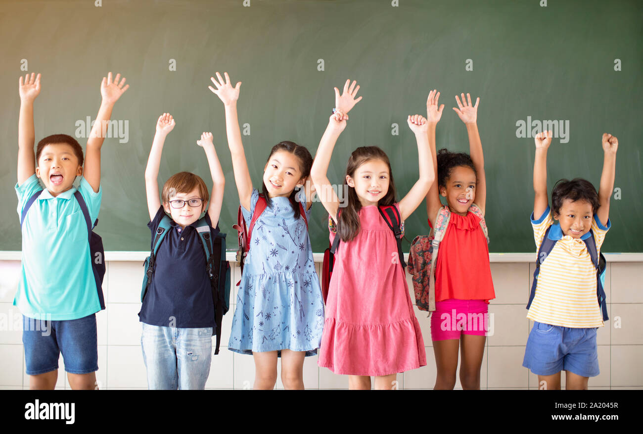 Elementary school students standing in hi-res stock photography and ...