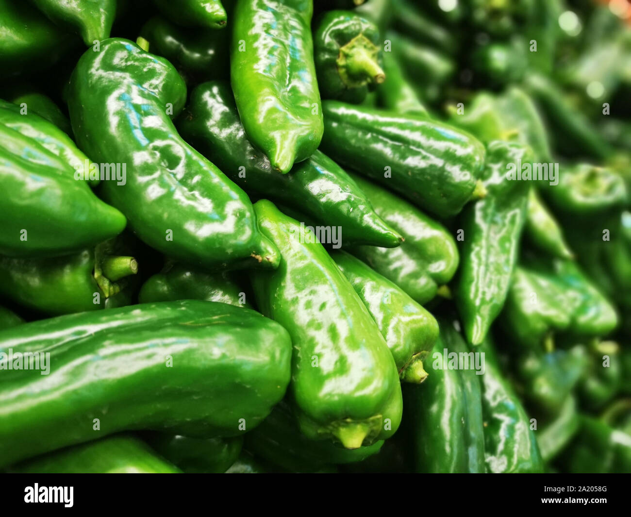 Green pepper in a harvest background. close up shot Stock Photo - Alamy