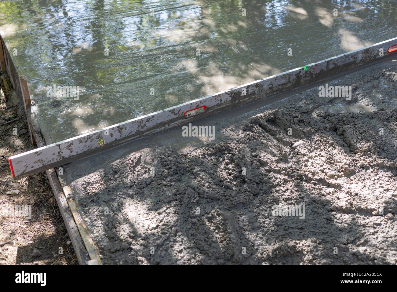 Picture of a straight metal board to level fresh concrete floor Stock ...