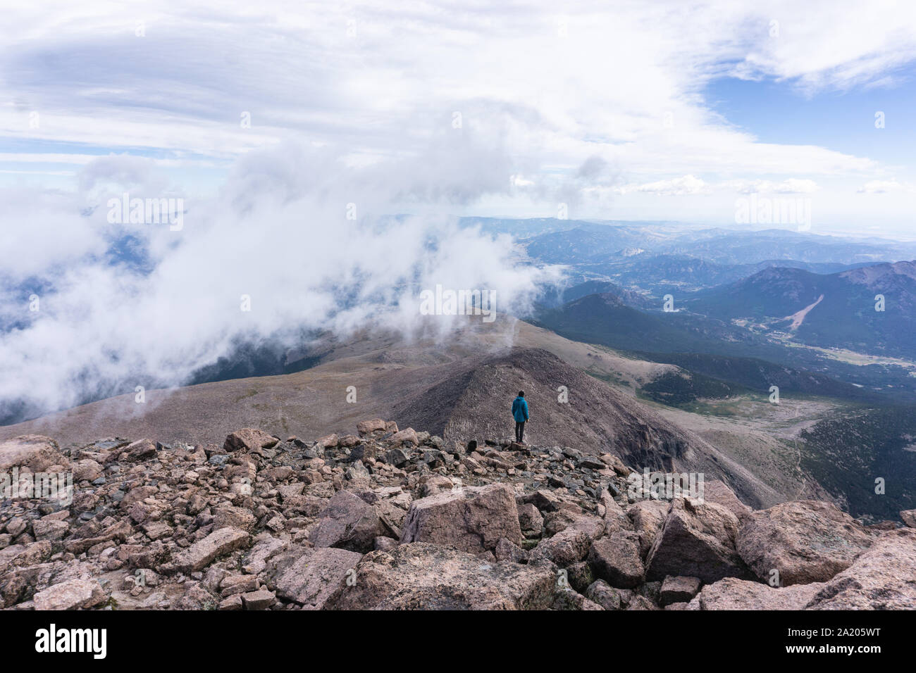 Hiker looking out over mountains hi-res stock photography and images ...