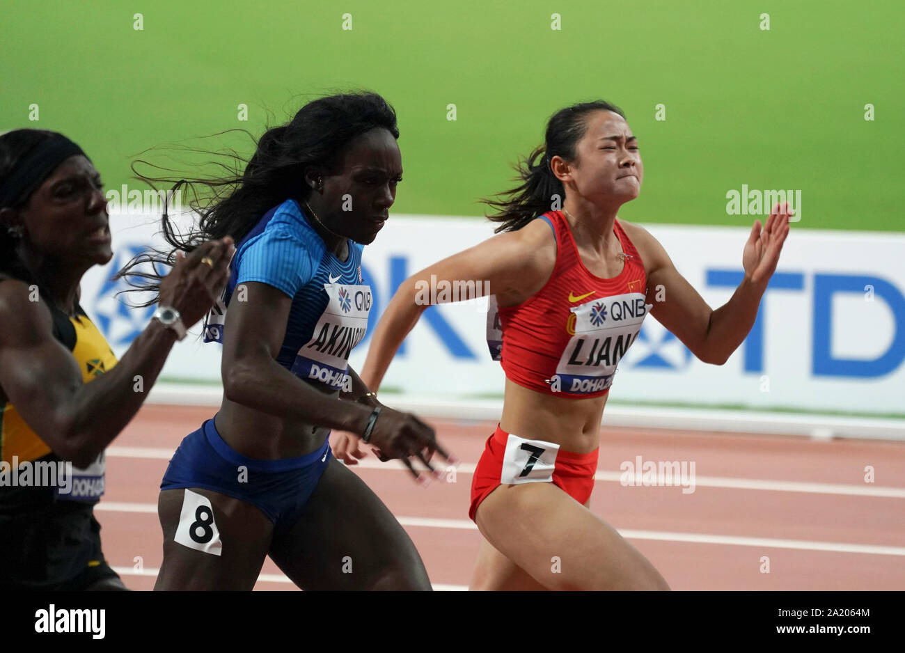 Doha, Qatar. 29th Sep, 2019. Liang Xiaojing (R) of China competes ...