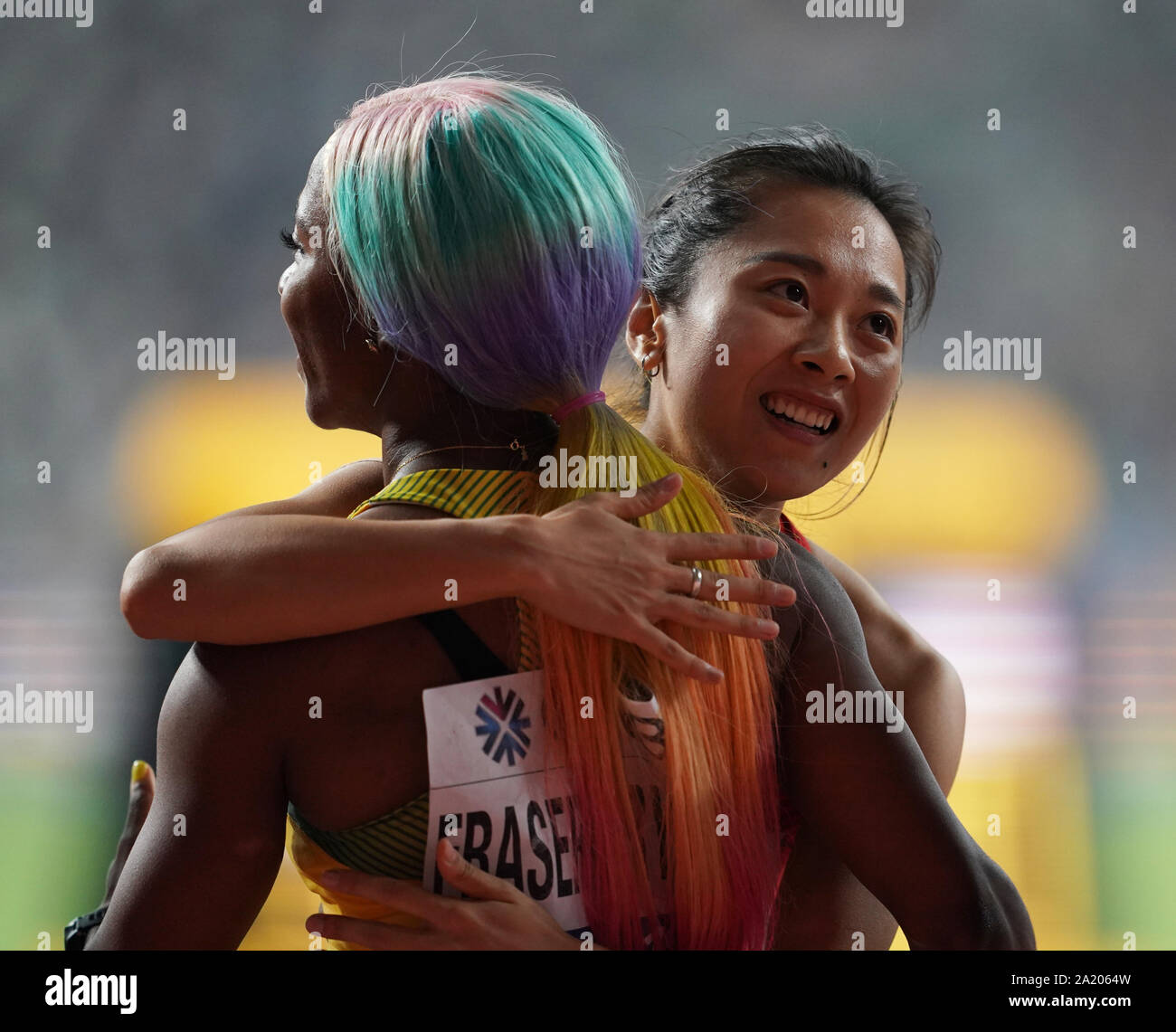 Doha, Qatar. 29th Sep, 2019. Ge Manqi(R) of China hugs Shelly-Ann ...