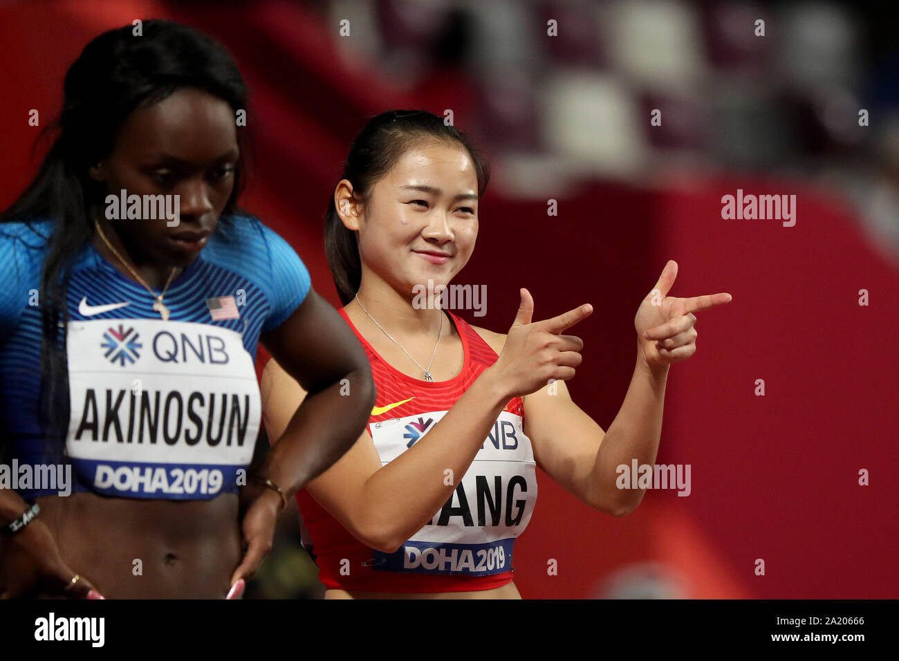 Doha, Qatar. 29th Sep, 2019. Liang Xiaojing (R) of China gestures ...
