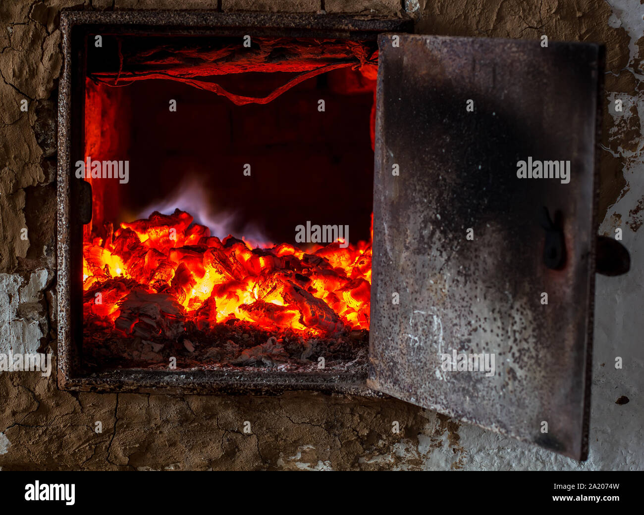 the old chapped Russian oven smolder charcoal Stock Photo - Alamy