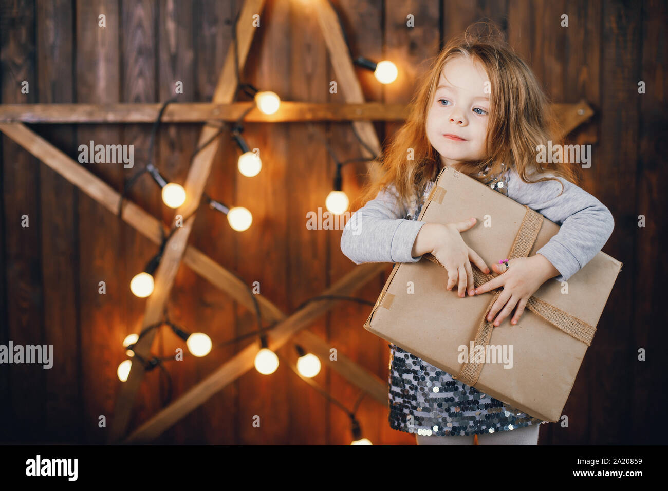 litle girl opening presents Stock Photo - Alamy