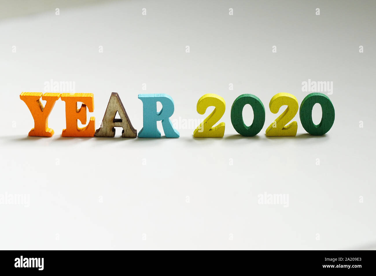 Colourful Year 2020 wording made of wooden alphabet letter on white ...