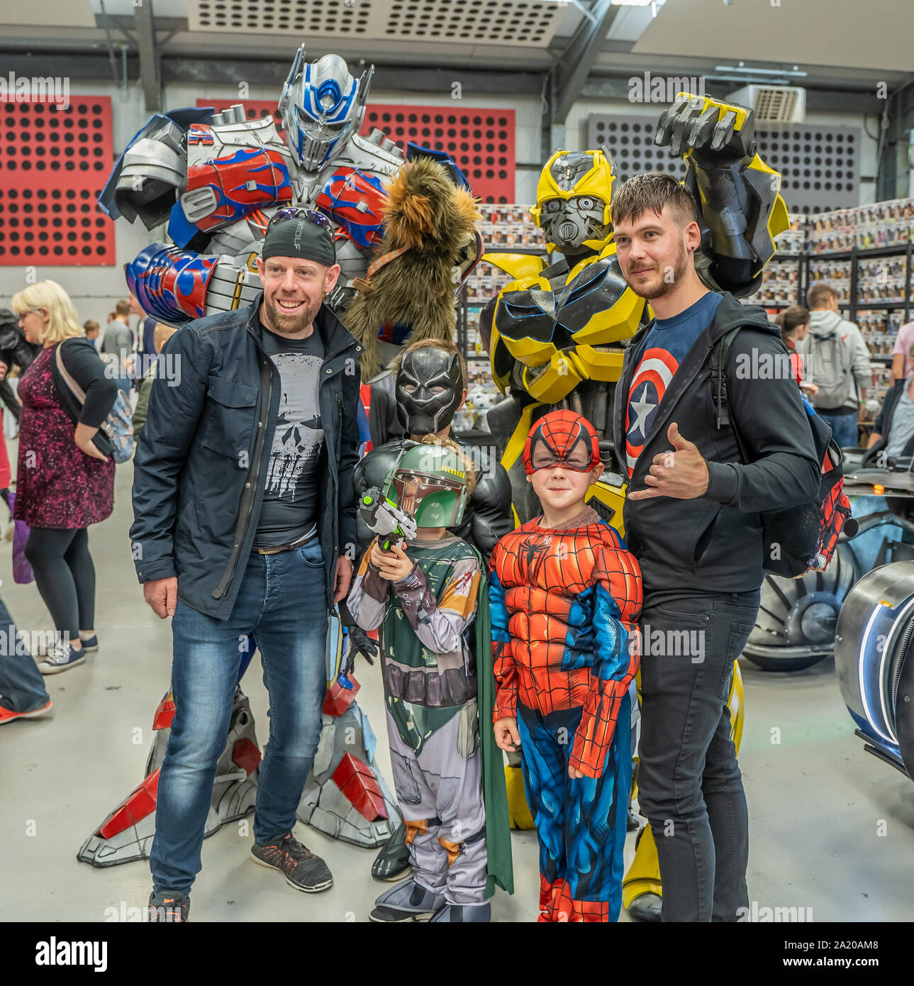 A group of people dressed up as various comic and movie characters at ...