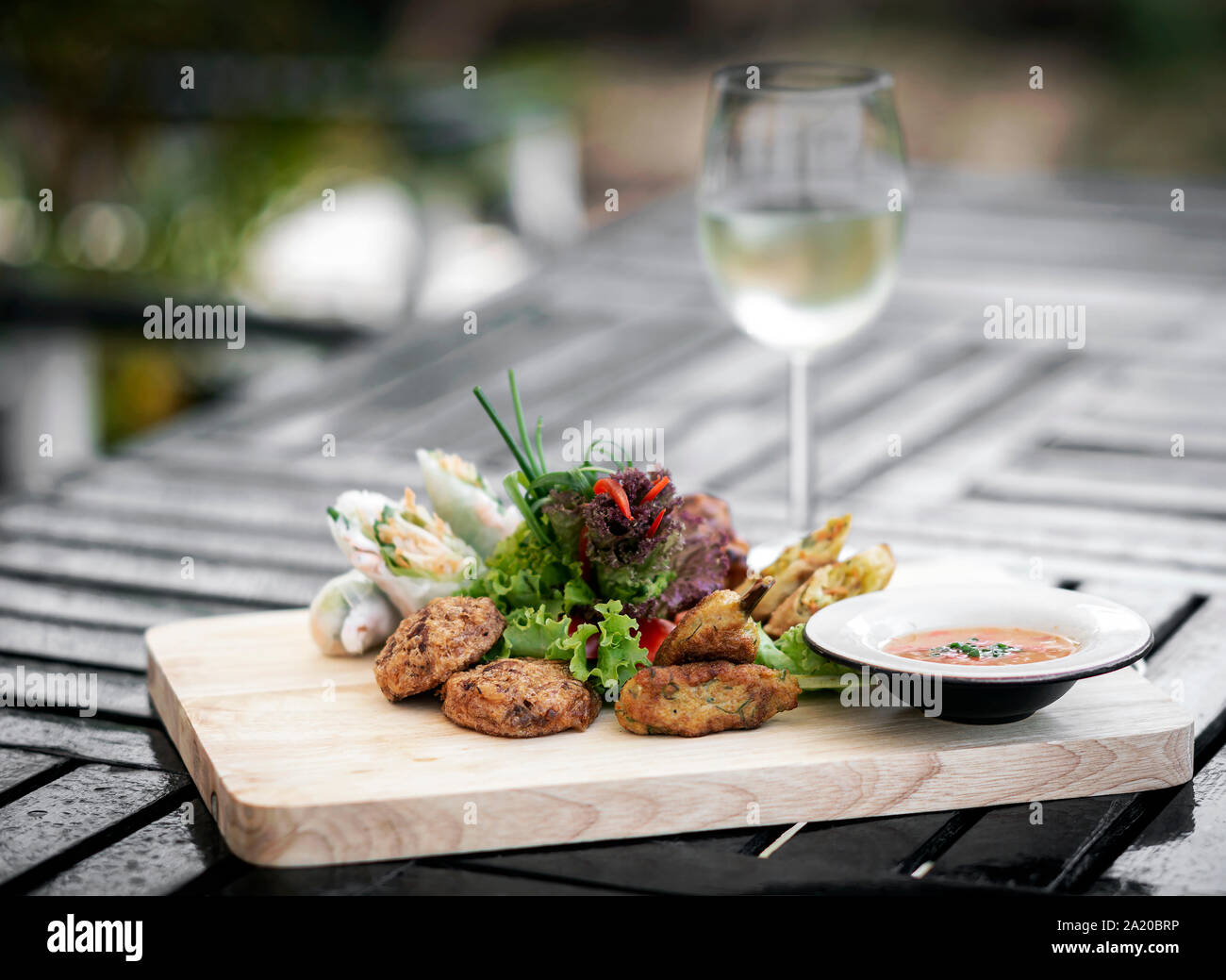 mixed asian seafood snacks tapas platter on bangkok restaurant table ...