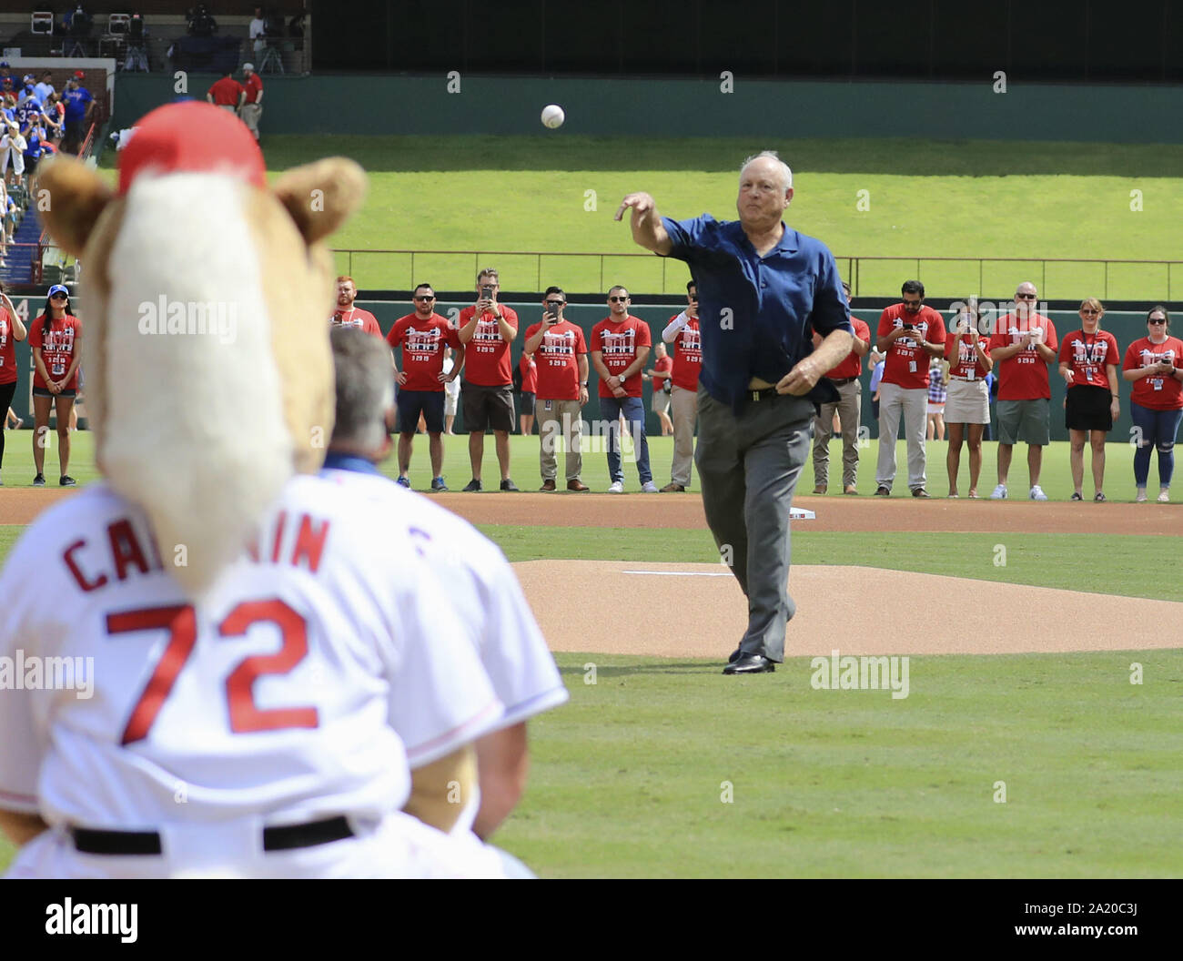 Hall of Fame inductee Nolan Ryan throws the ceremonial first pitch ...