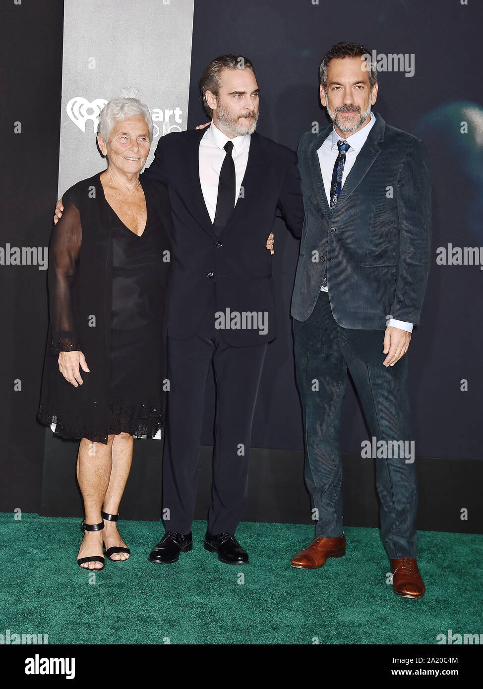 HOLLYWOOD, CA - SEPTEMBER 28: (L-R) Arlyn Phoenix, Joaquin Phoenix and ...