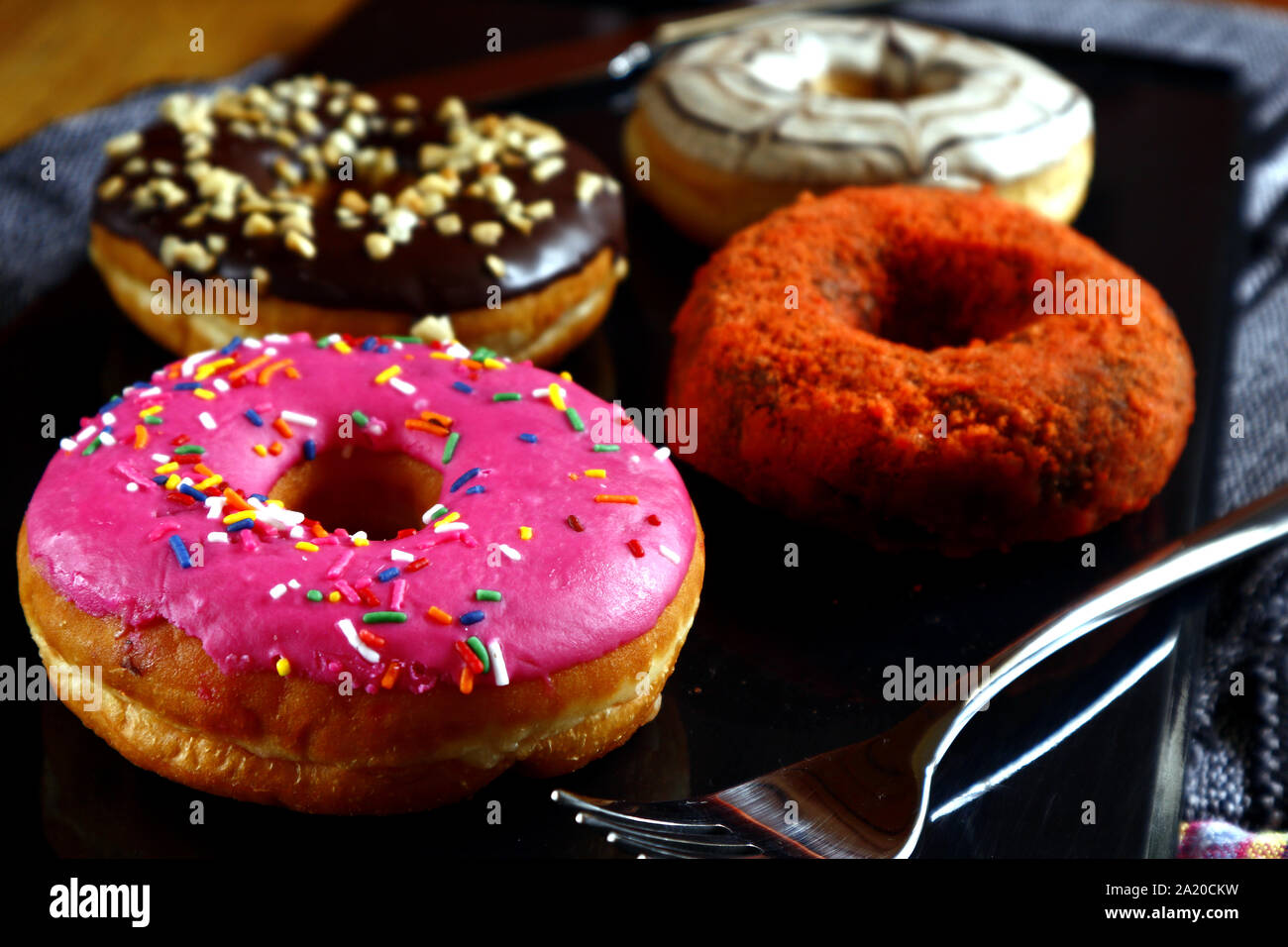 Photo of freshly made assorted sweet donuts Stock Photo - Alamy