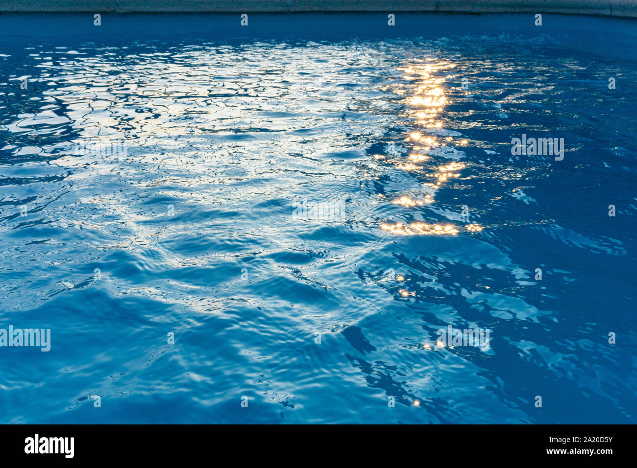 Pool with sun reflection in the water Stock Photo - Alamy