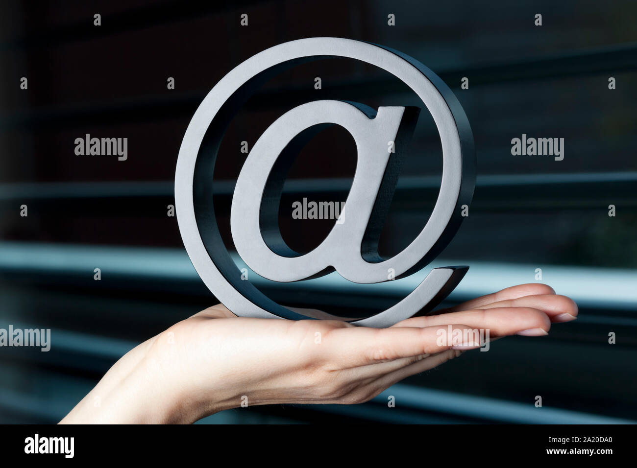 At-symbol held in hand Stock Photo - Alamy