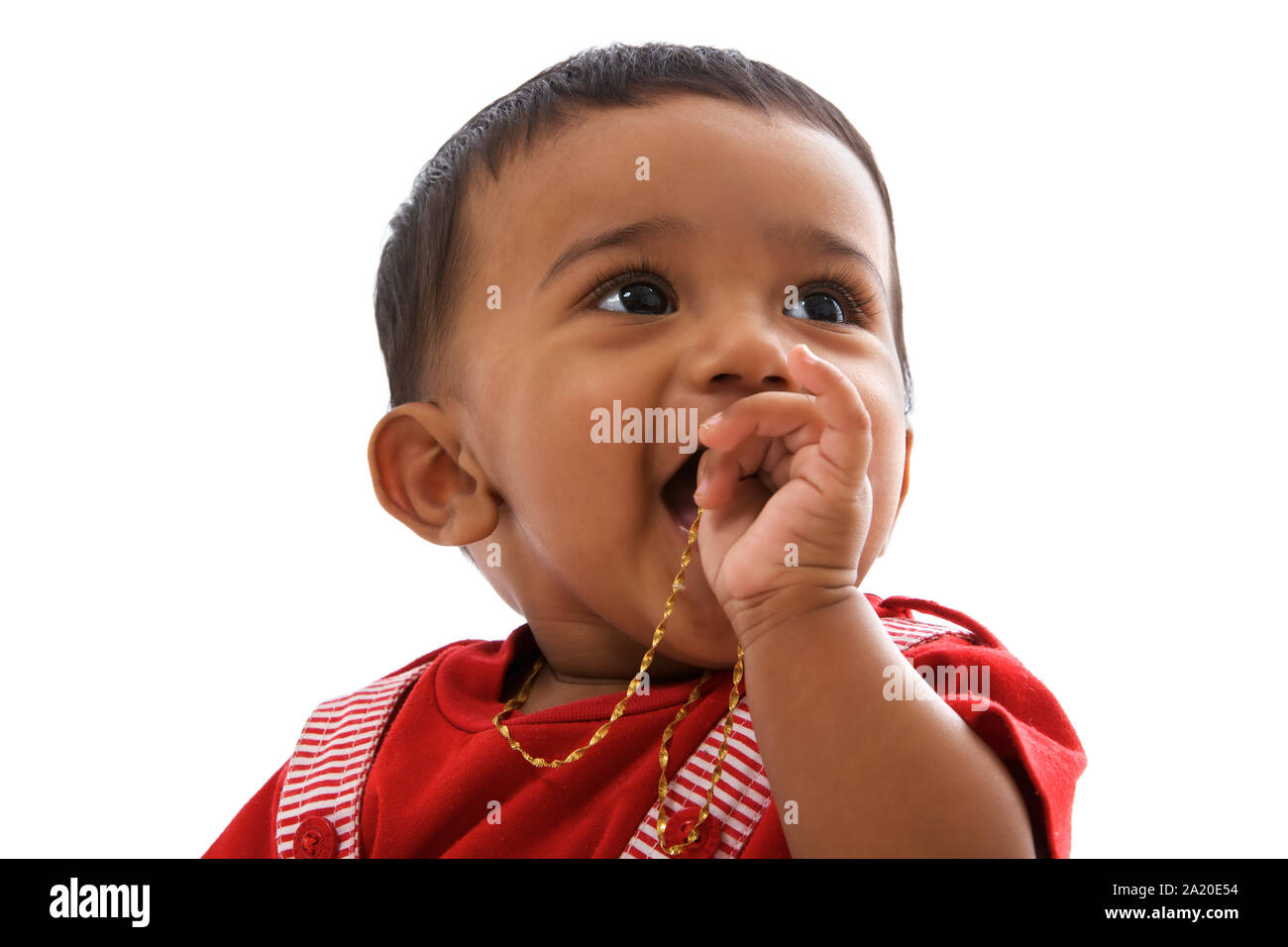 Portrait of sweet indian baby, looking right Stock Photo - Alamy