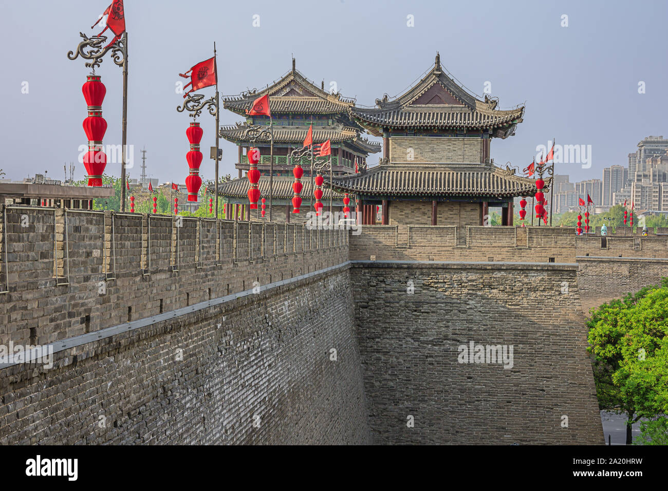 Watch towers in the city wall of Xi'an with modern buildings in the ...
