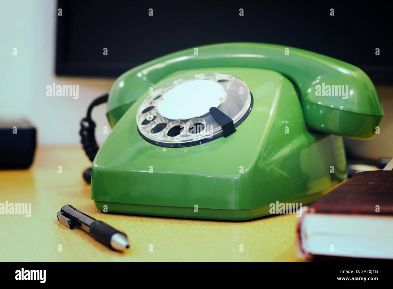 Retro green rotary phone on the desktop Stock Photo - Alamy