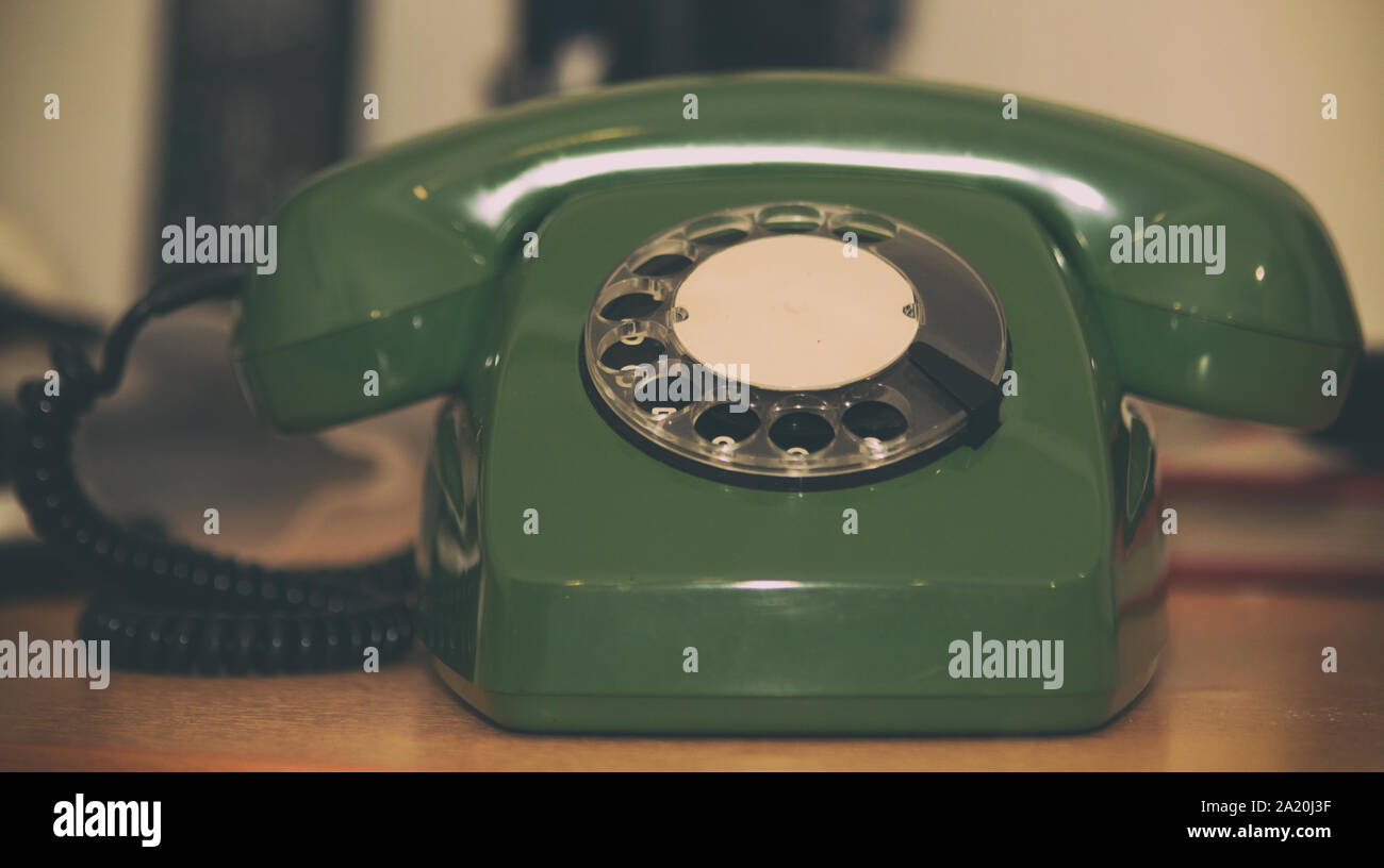 Retro green rotary phone on the desktop Stock Photo - Alamy