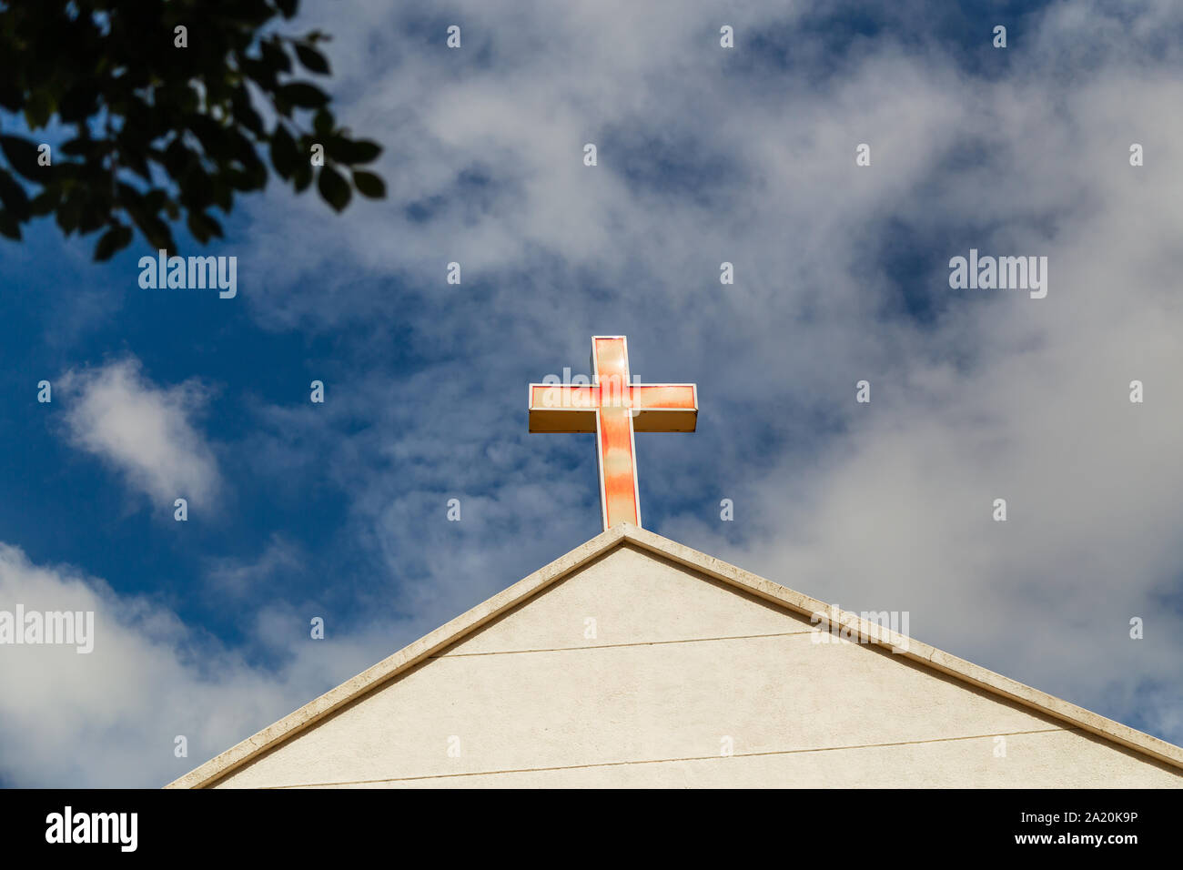 Faded red cross on church roof Stock Photo - Alamy