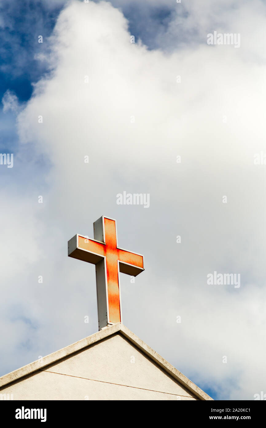 Faded red cross on church roof Stock Photo - Alamy