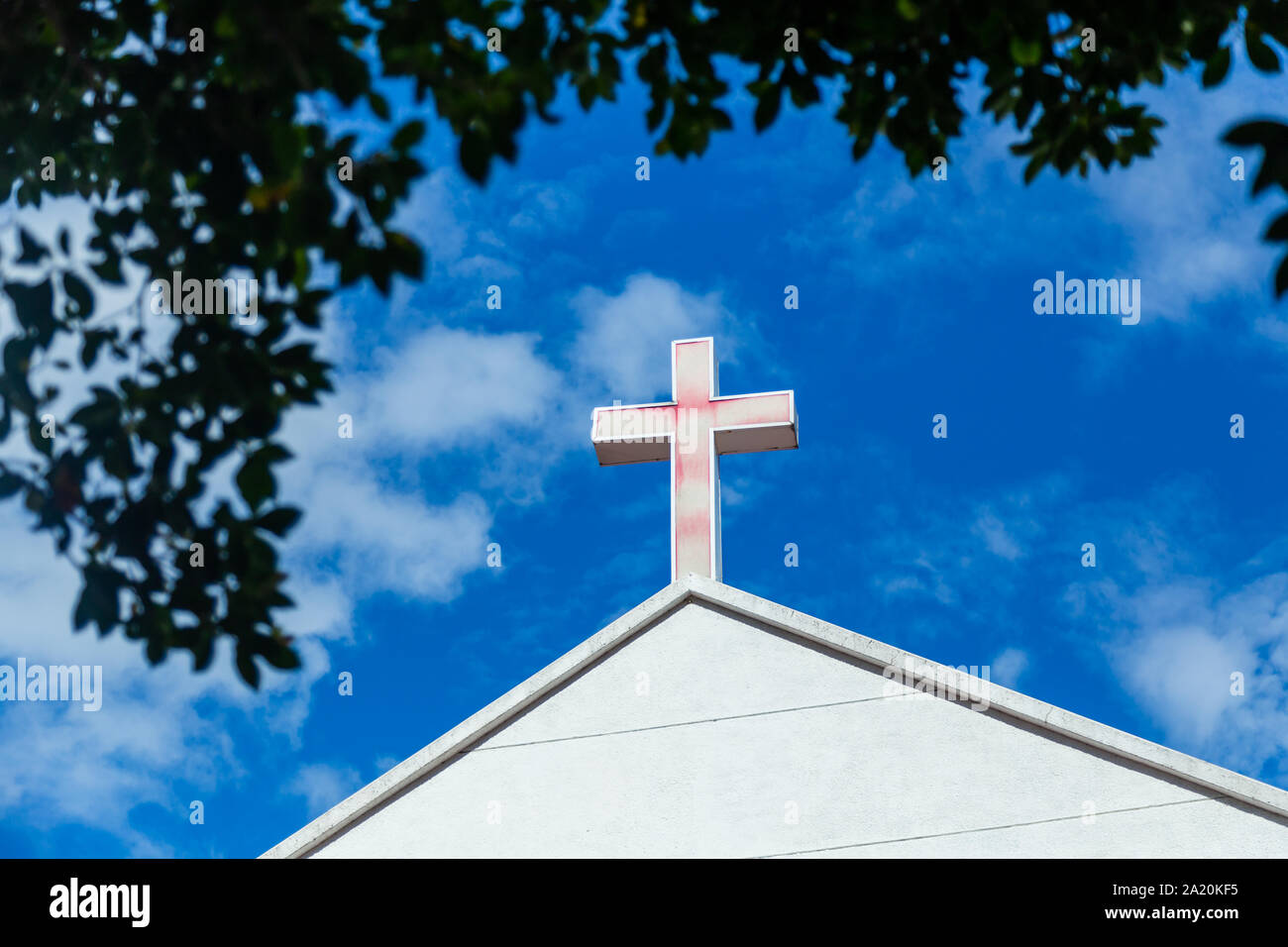 Faded red cross on church roof Stock Photo - Alamy