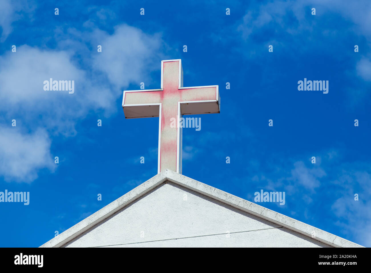 Faded red cross on church roof Stock Photo - Alamy