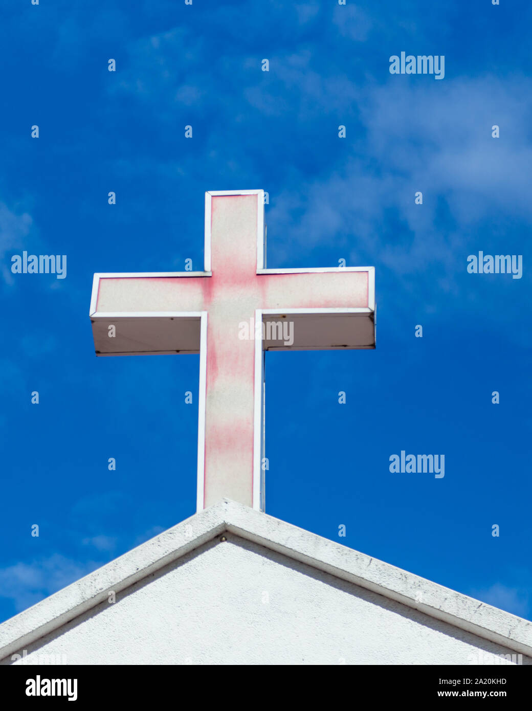 Faded red cross on church roof Stock Photo - Alamy
