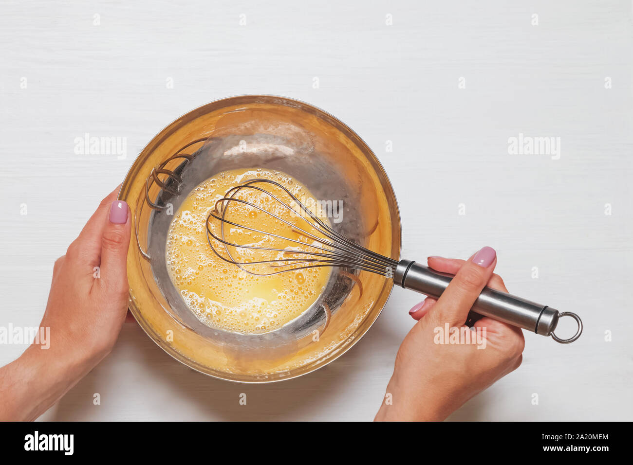 Mixing eggs and flour in bowl hi-res stock photography and images - Alamy